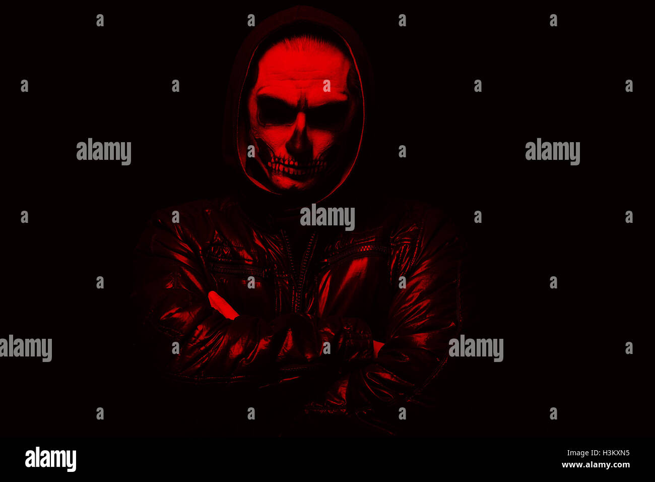 Evil man on black background Stock Photo - Alamy