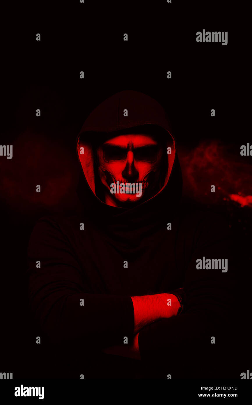 Evil man on black background Stock Photo - Alamy