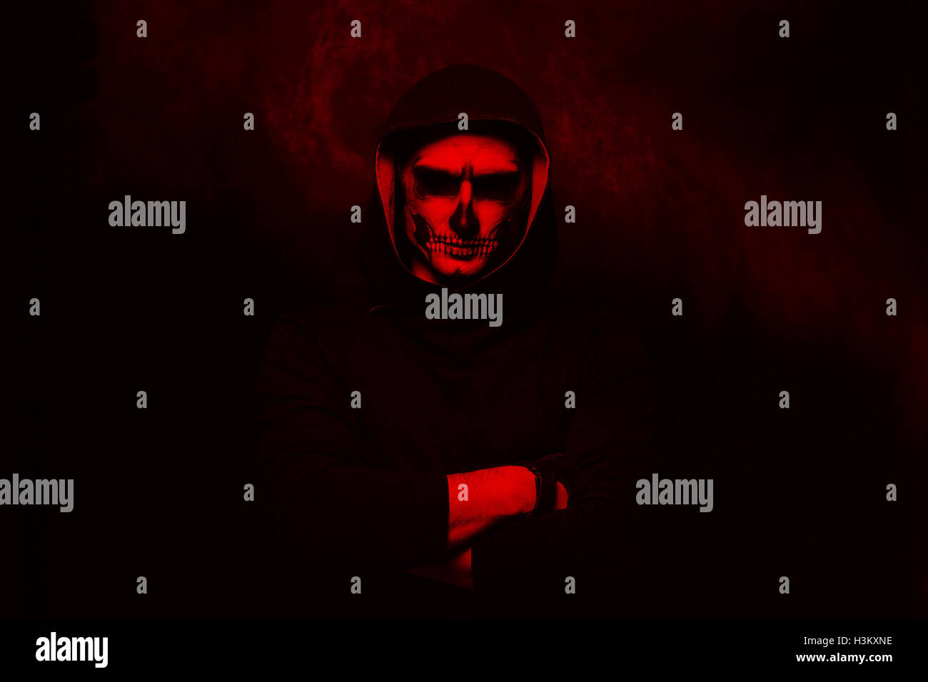 Evil man on black background Stock Photo - Alamy