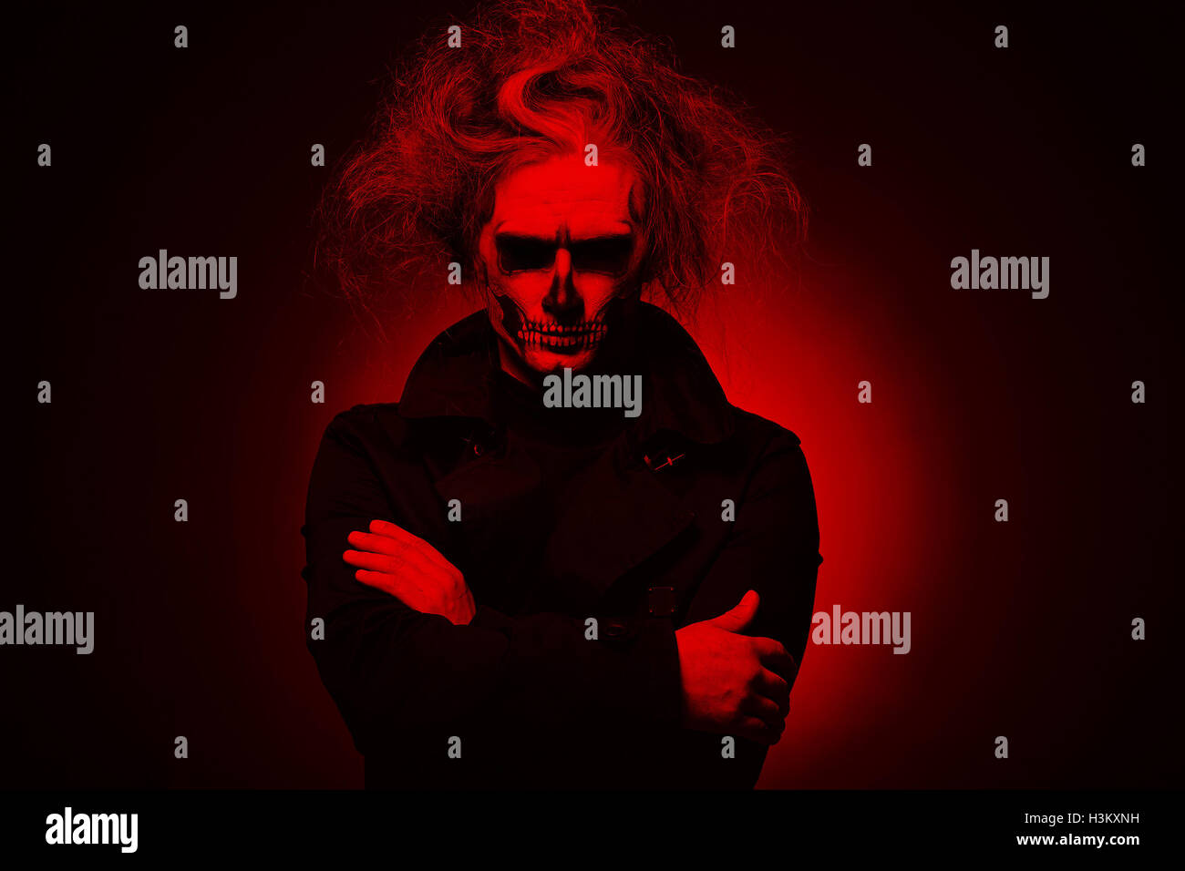 Evil man on black background Stock Photo - Alamy
