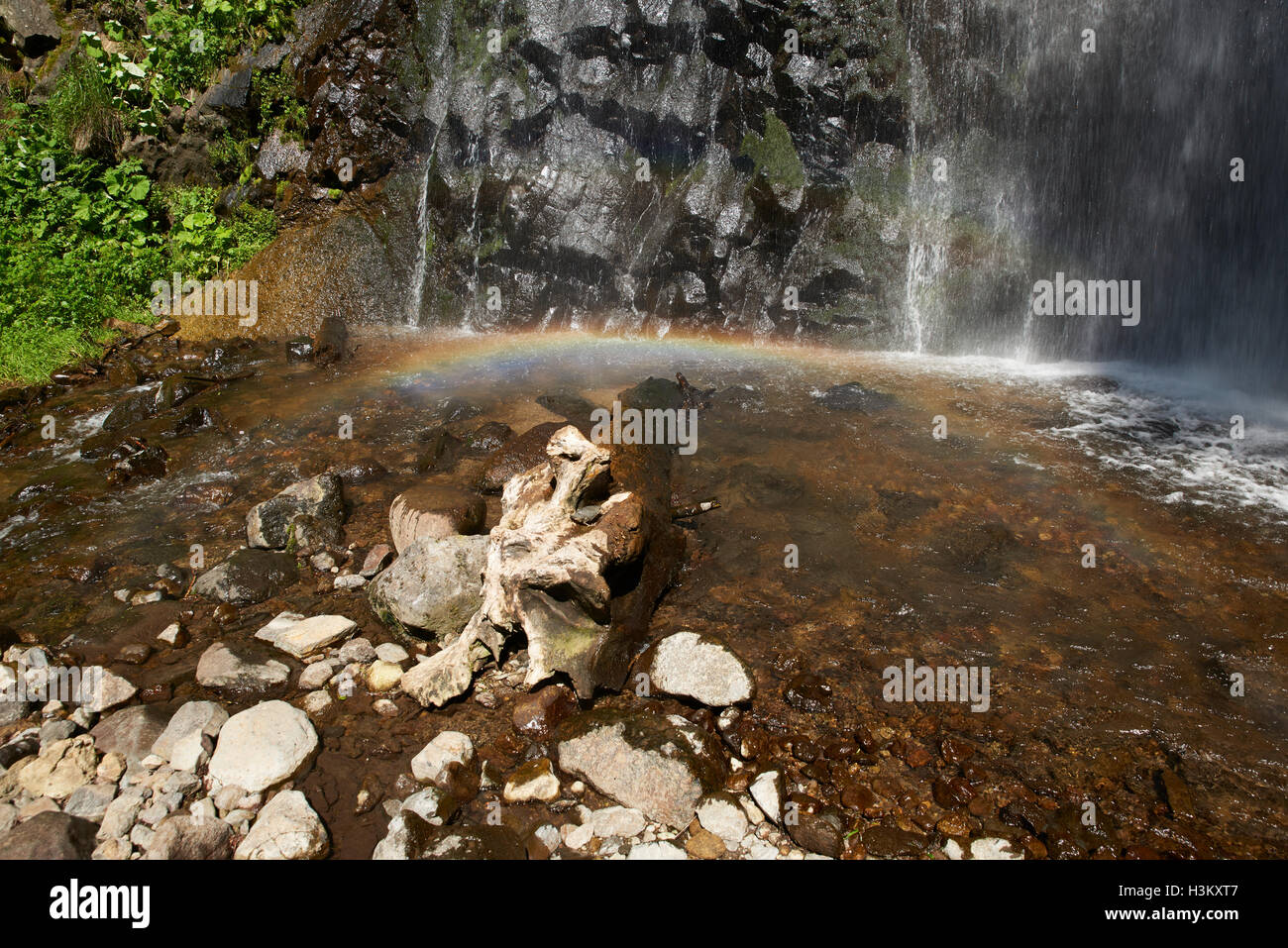 Rainbow down the waterfall Stock Photo - Alamy