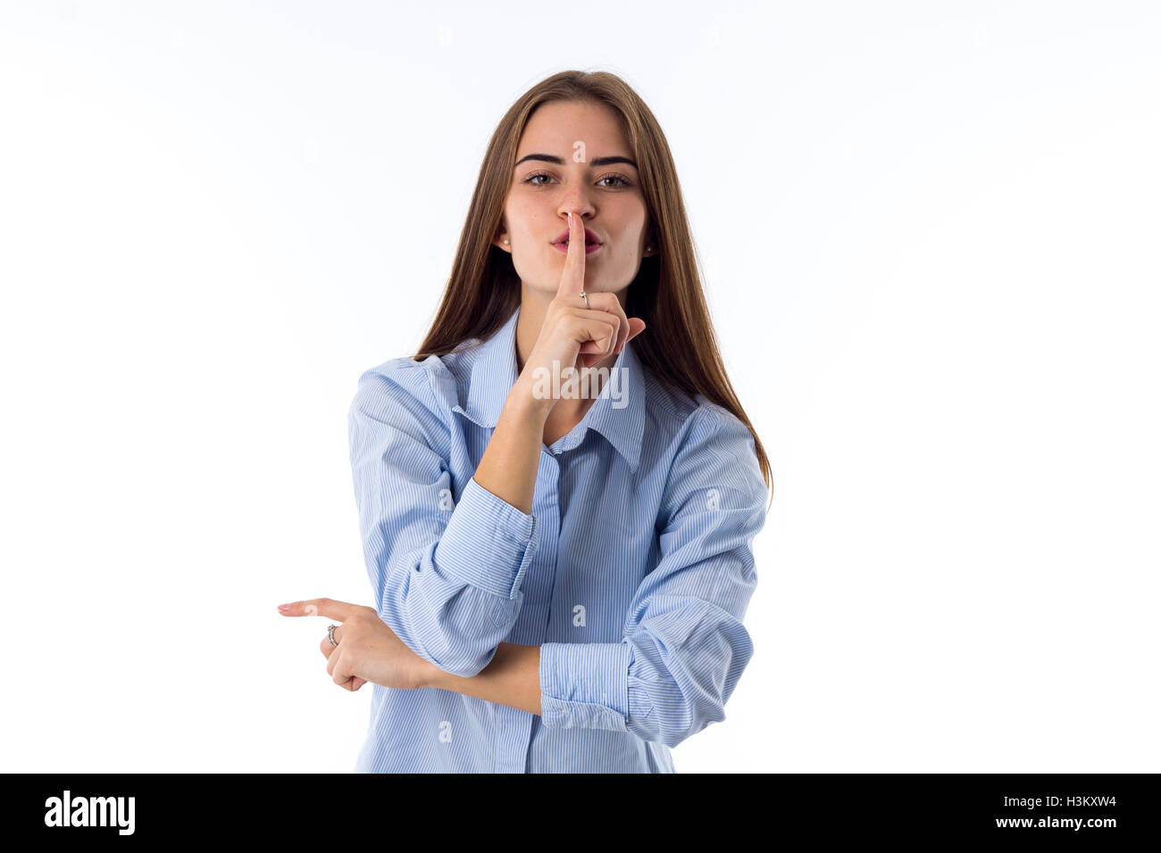 Woman asking to be quiet Stock Photo - Alamy