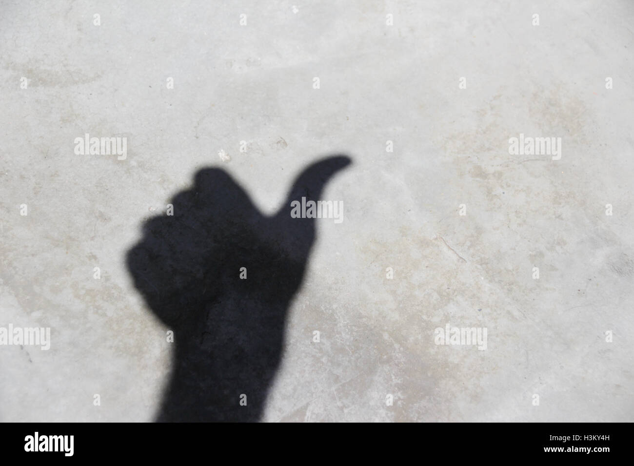 Human hand shadow or silhouette on concrete floor Stock Photo - Alamy