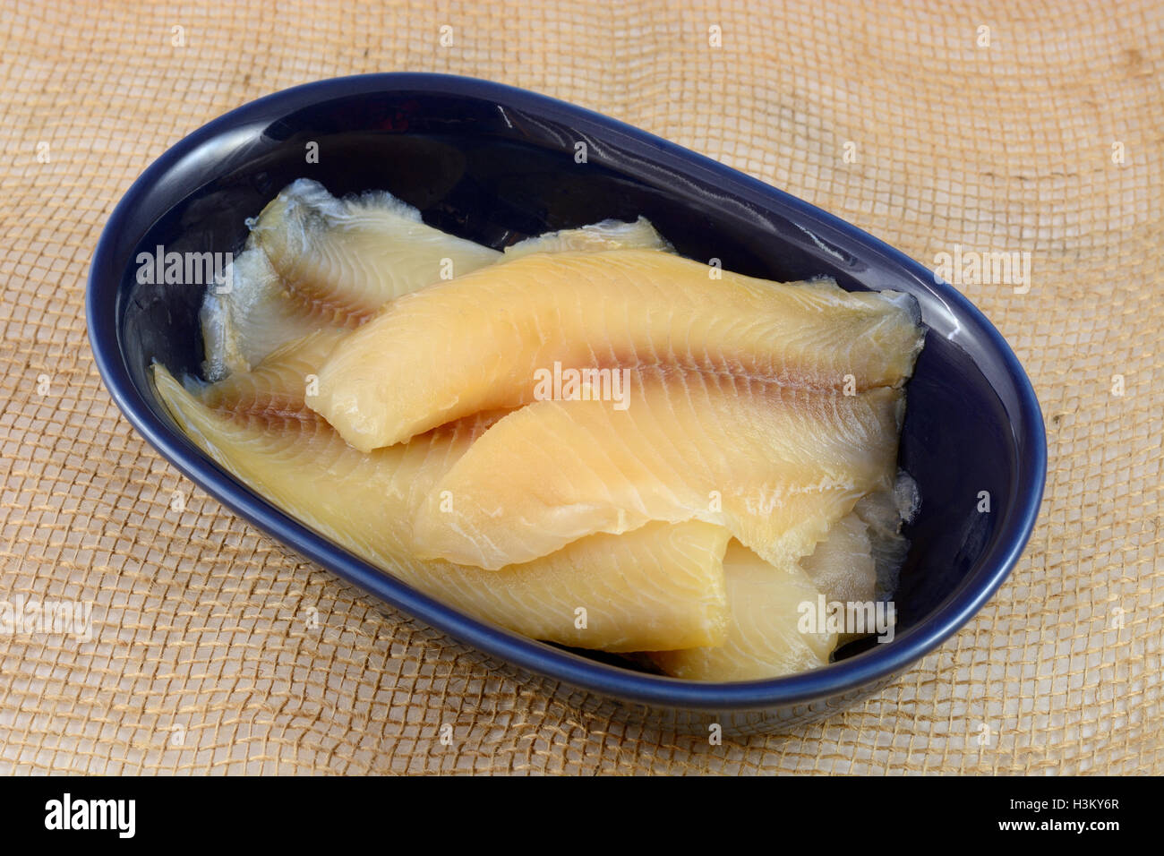 Ttilapia fish fillets thawing in blue dish Stock Photo - Alamy