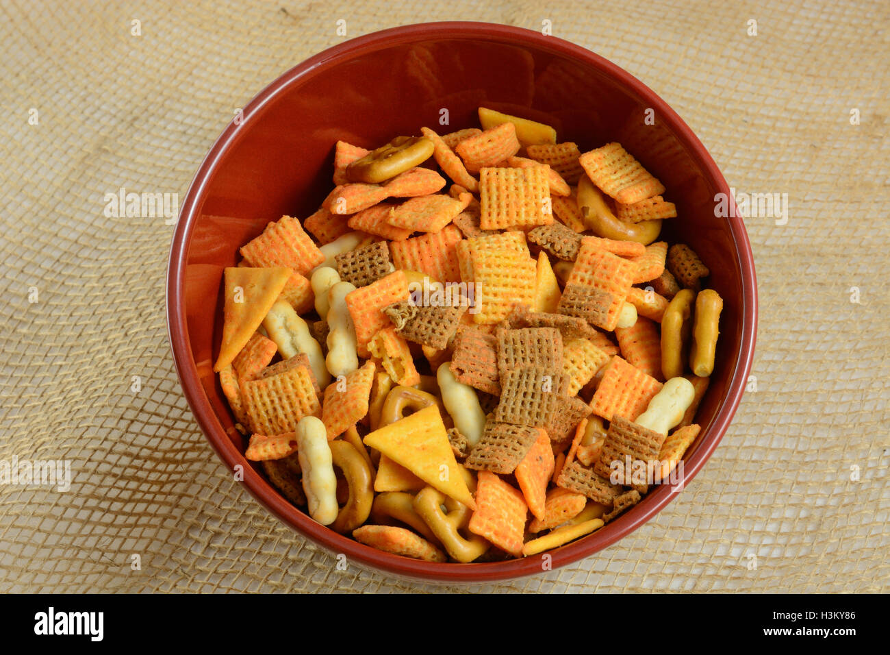 Cheese flavored Party snacks in red bowl Stock Photo - Alamy