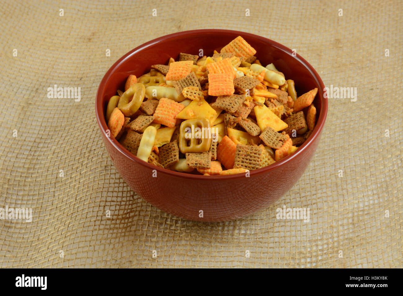 Cheese flavored Party snacks in red bowl Stock Photo - Alamy