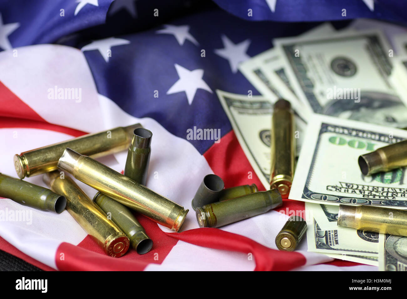 bullet and money on the american flag Stock Photo - Alamy