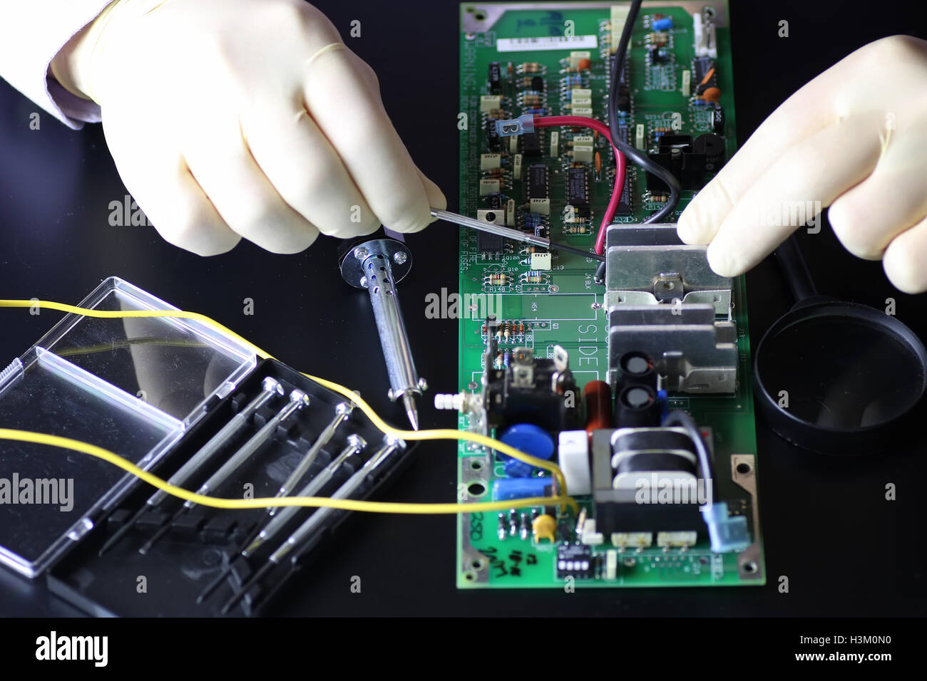 man hands chip soldering tools Stock Photo - Alamy