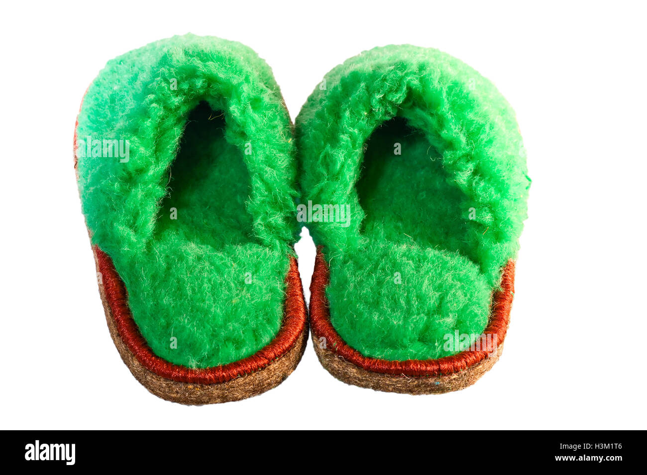 green slippers on a white background of wool sheep Stock Photo - Alamy