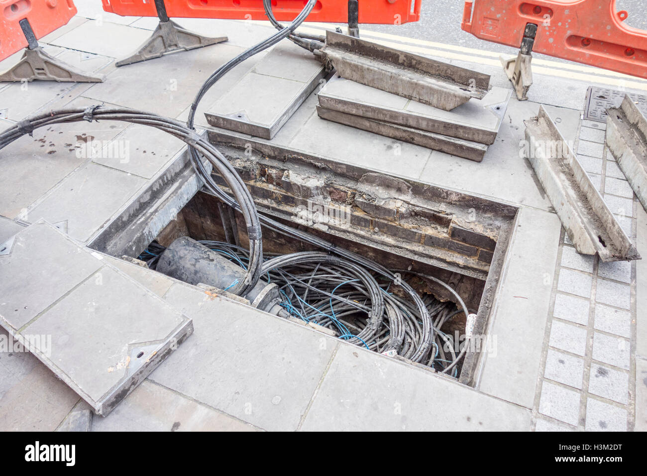 Barriered roadworks on a pavement in London Stock Photo - Alamy