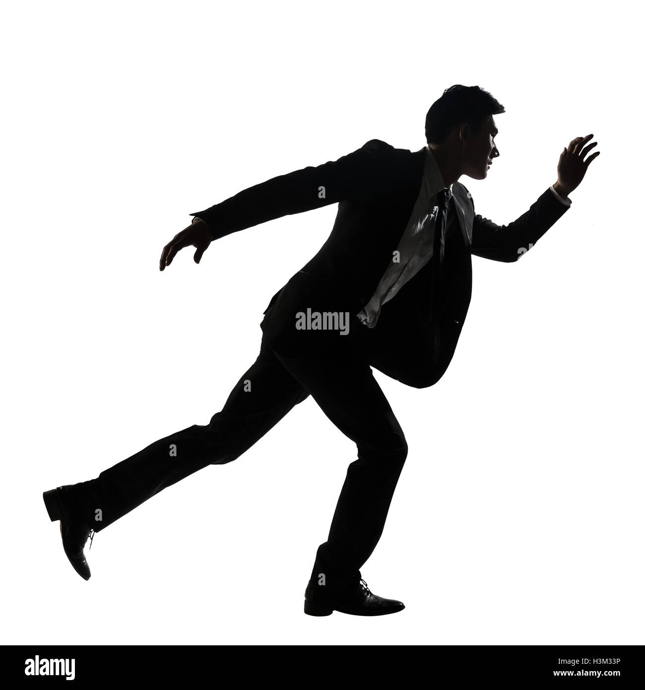 Running businessman silhouette Cut Out Stock Images & Pictures - Alamy