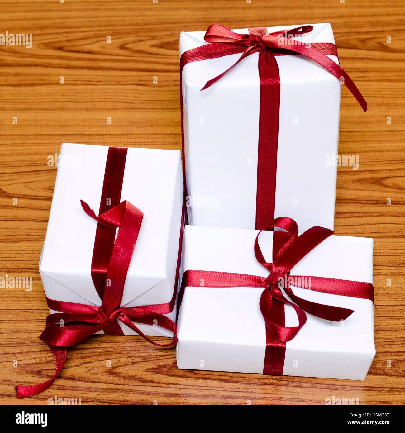 white gift box with red ribbin Stock Photo - Alamy