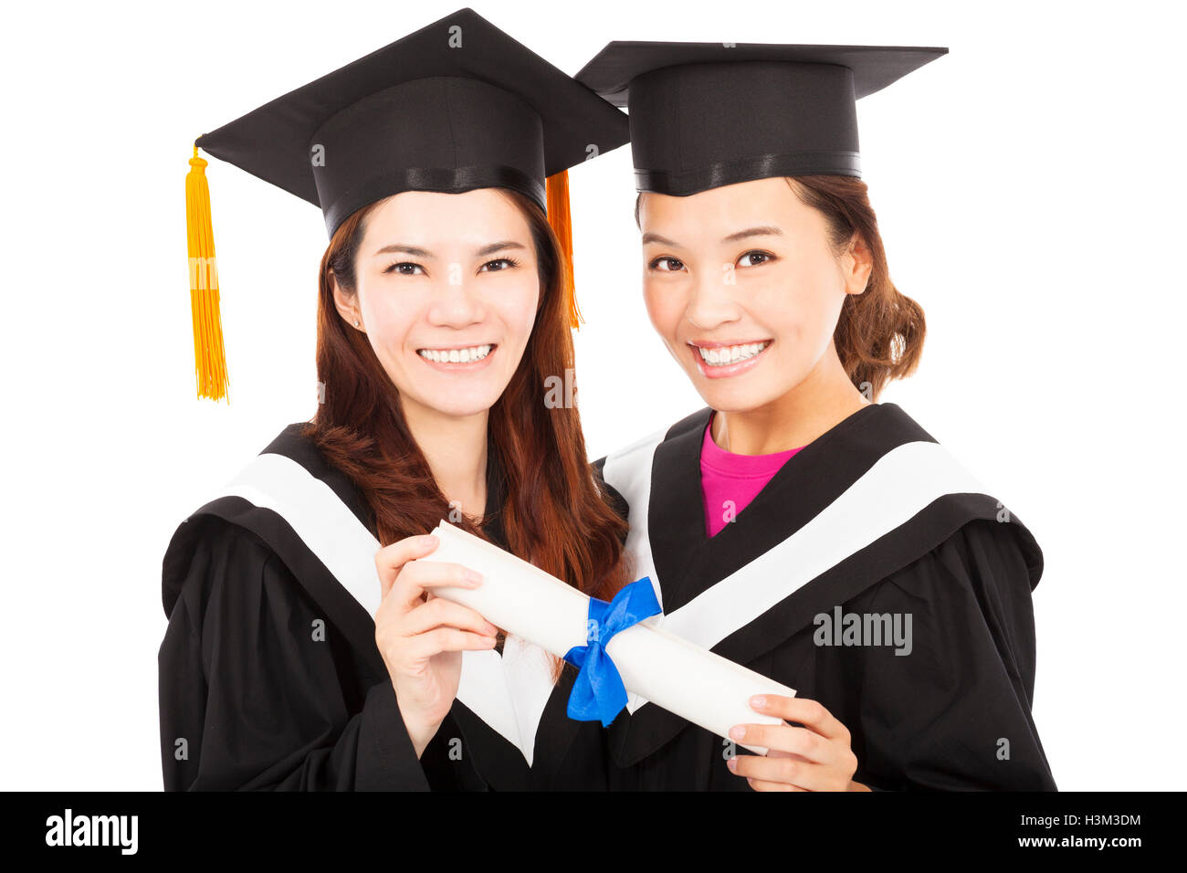 two smiling young graduate students holding a diploma Stock Photo - Alamy