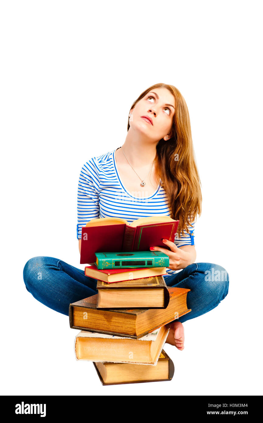 thoughtful student and pile of books Stock Photo - Alamy