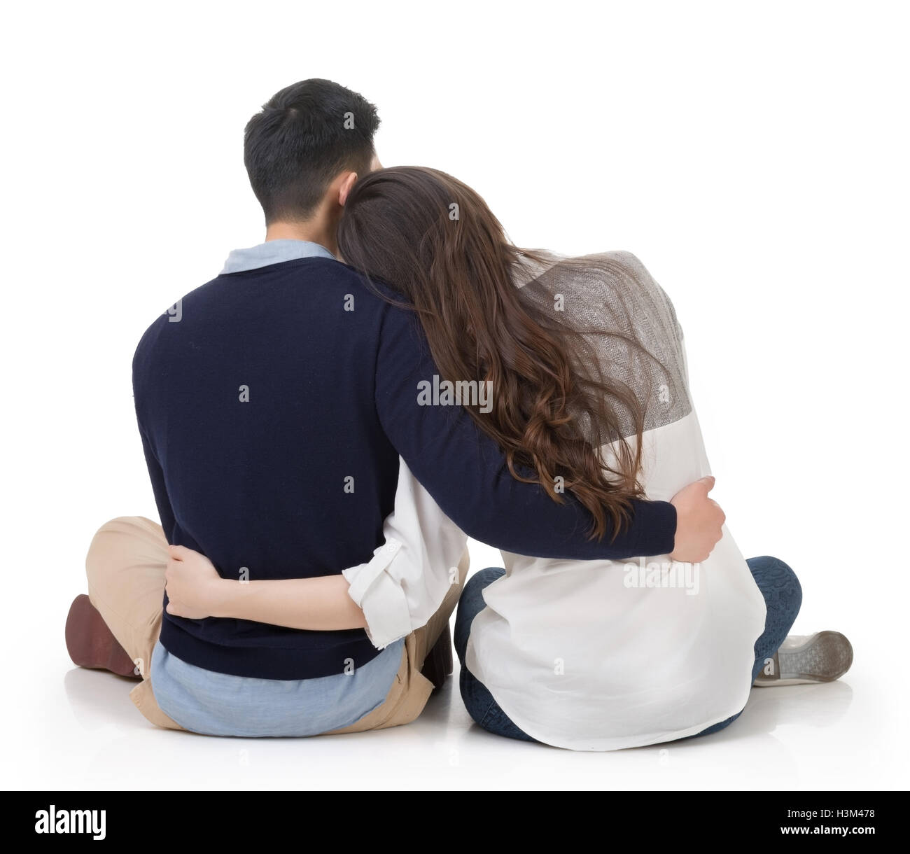 Asian couple sit on ground Stock Photo - Alamy