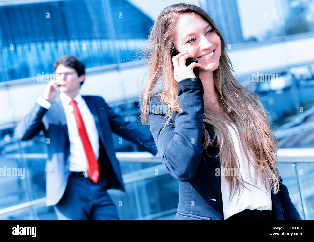 Junior executive dynamic phoning outside of her office Stock Photo - Alamy