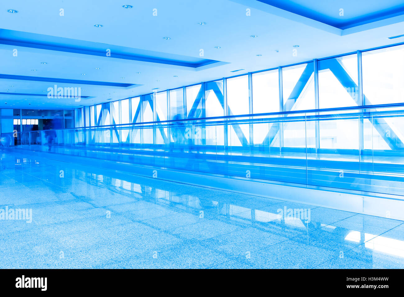 corridor structure with glass walls in blue Stock Photo - Alamy