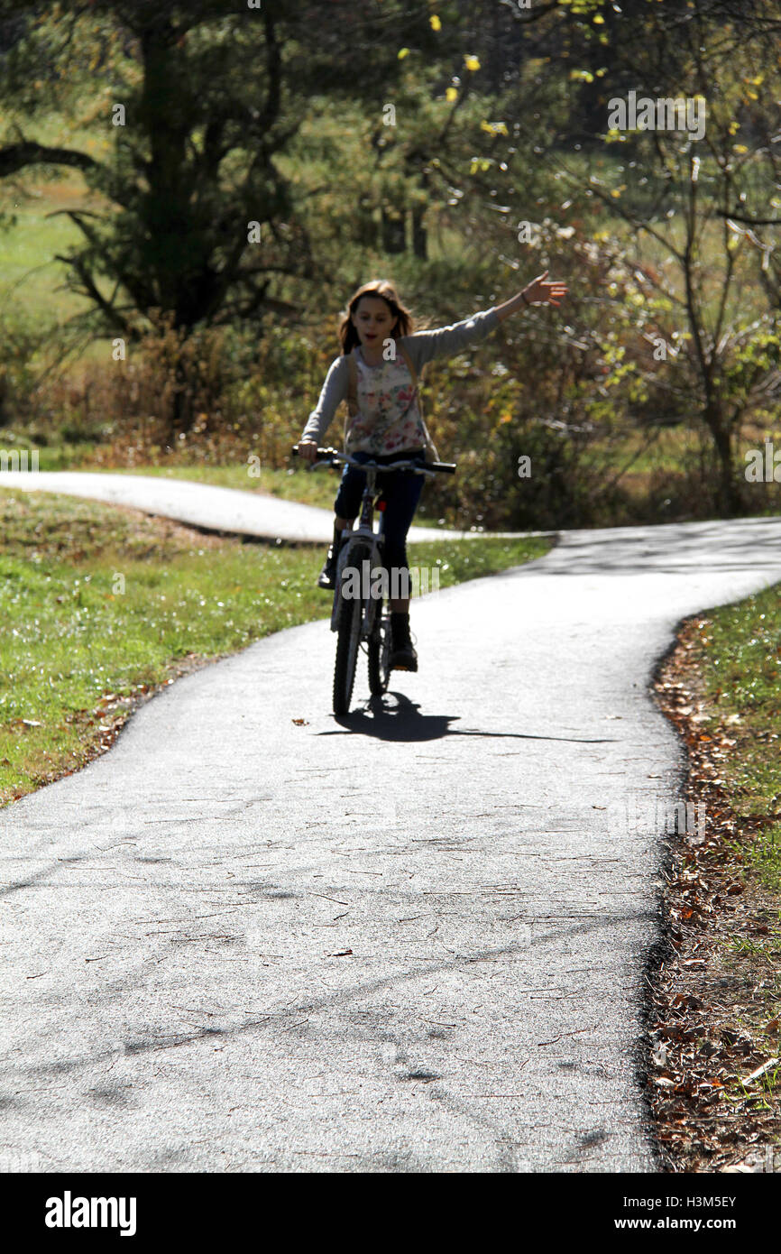 Back view girl riding bicycle hi-res stock photography and images - Alamy