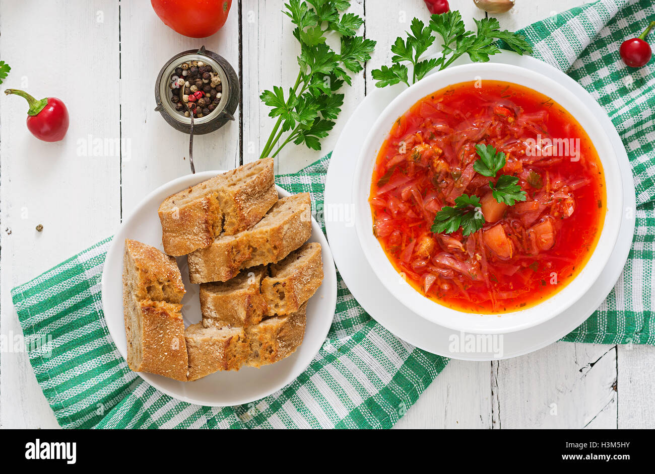Traditional Ukrainian Russian vegetable borscht on the white wooden background. Top view Stock ...