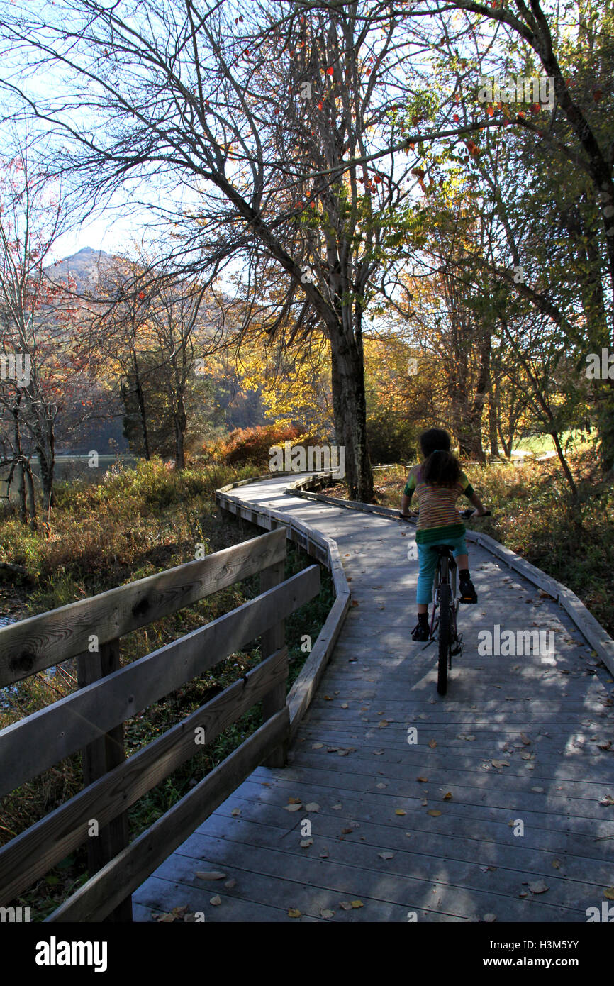 Virginia's Blue Ridge Mountains, USA. Little girl riding bicycle on ...
