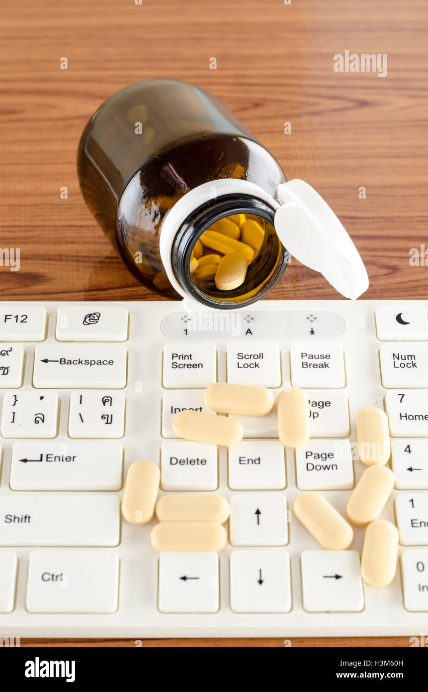 pills on keyboard computer Stock Photo - Alamy