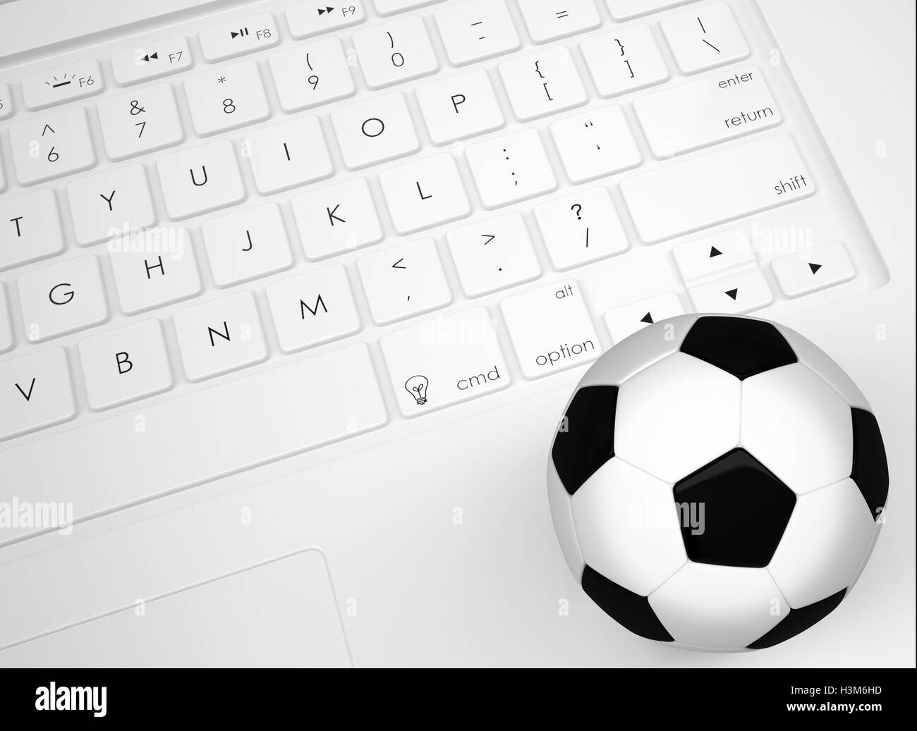 Soccer ball on the keyboard Stock Photo - Alamy