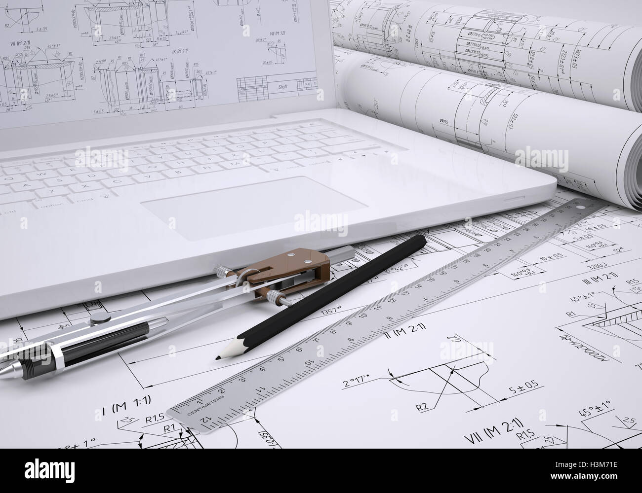 Scrolls engineering drawings and laptop Stock Photo - Alamy