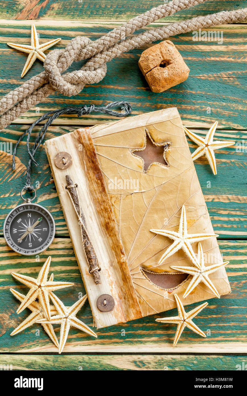 Old notepad with seashells on the deck Stock Photo - Alamy