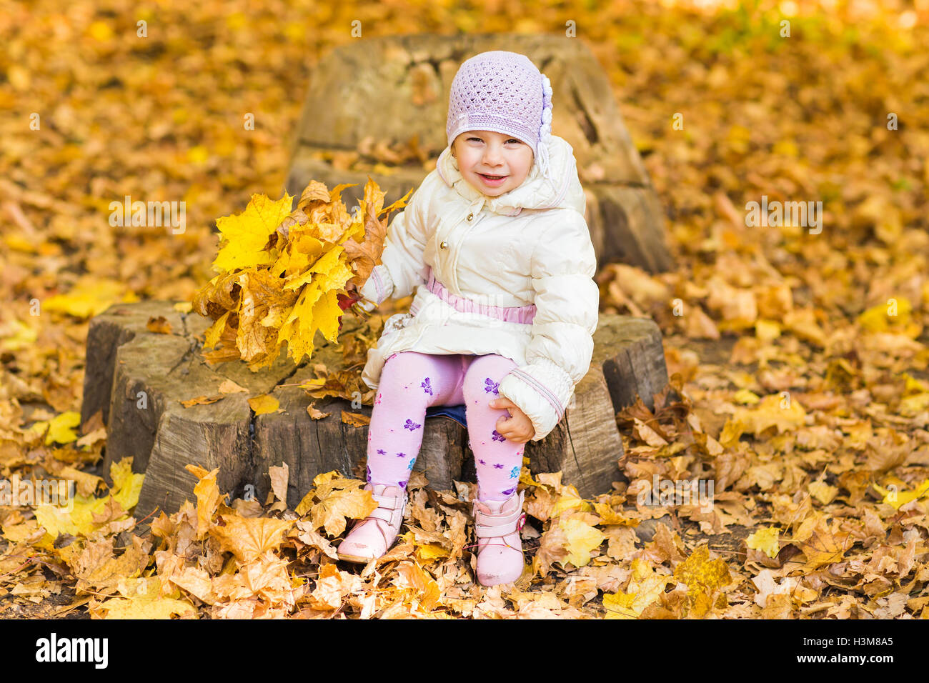 cute baby girl in fall time Stock Photo - Alamy