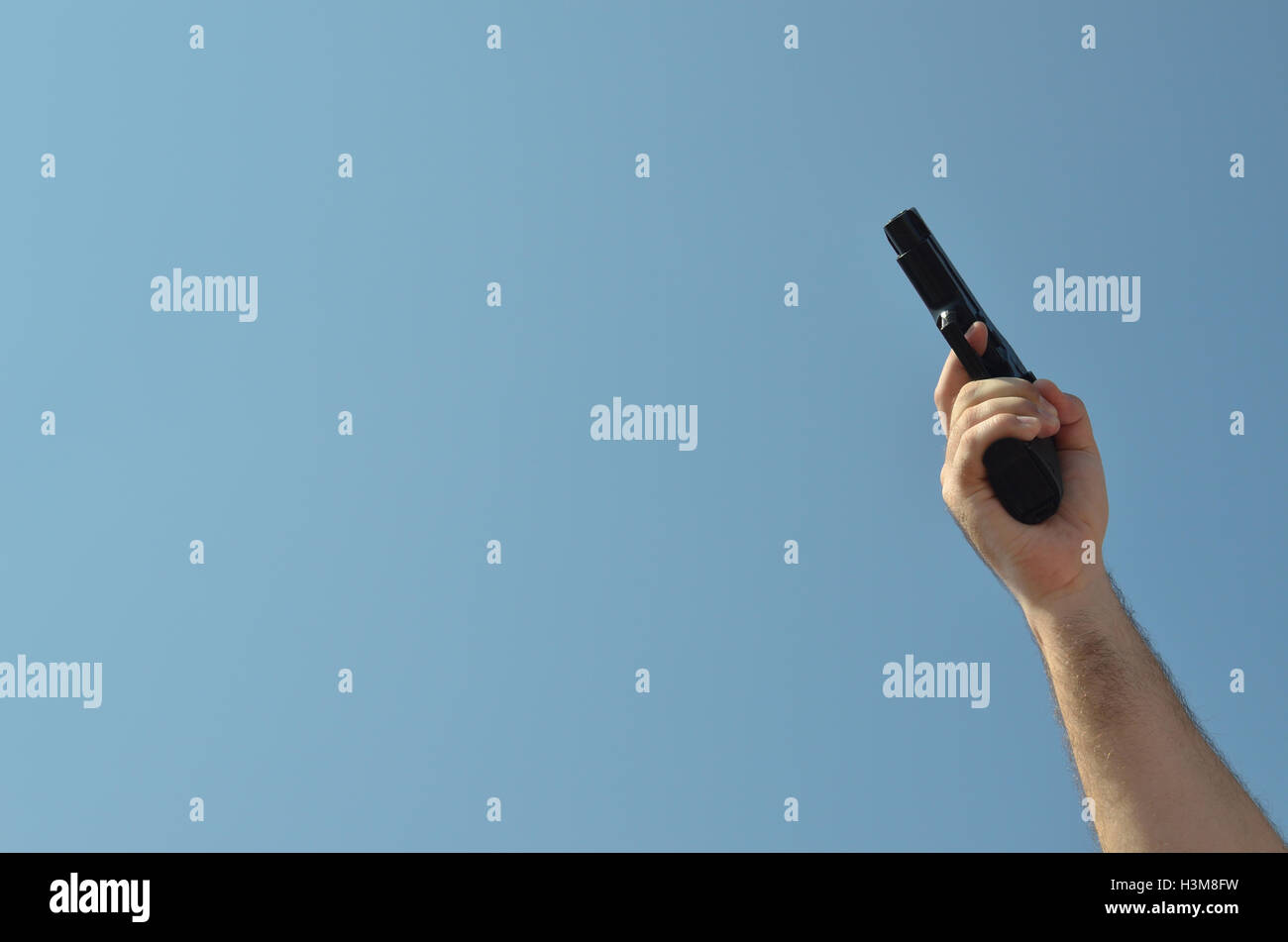 Replica of a gun pointed to the clear blue sky Stock Photo - Alamy