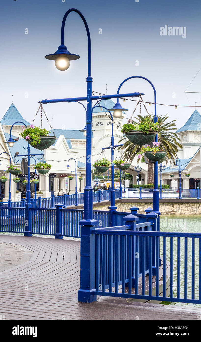 Lit lamp post with hanging pot plant flowers Stock Photo - Alamy