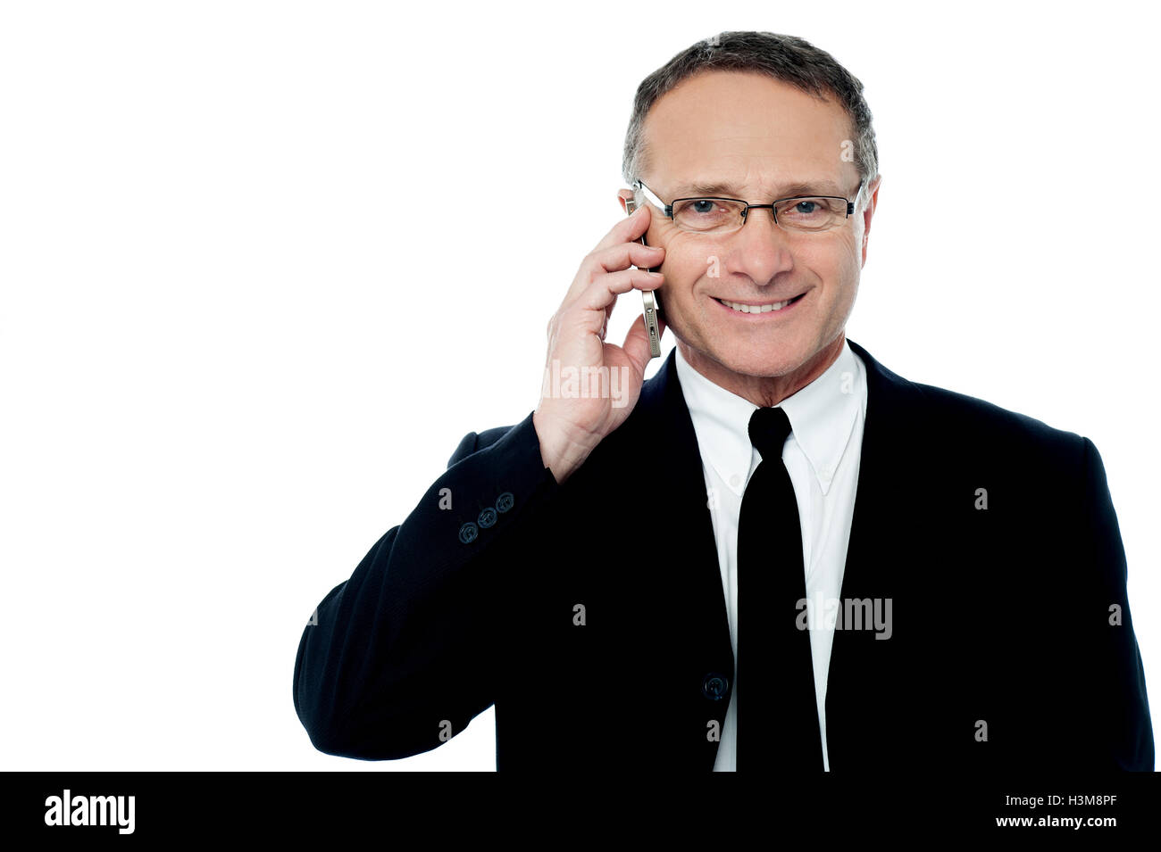 Happy business man making a call Stock Photo - Alamy