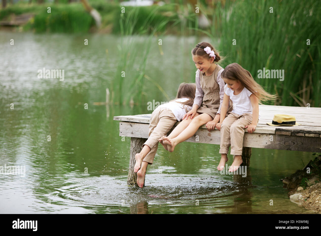Children near pond Stock Photo - Alamy