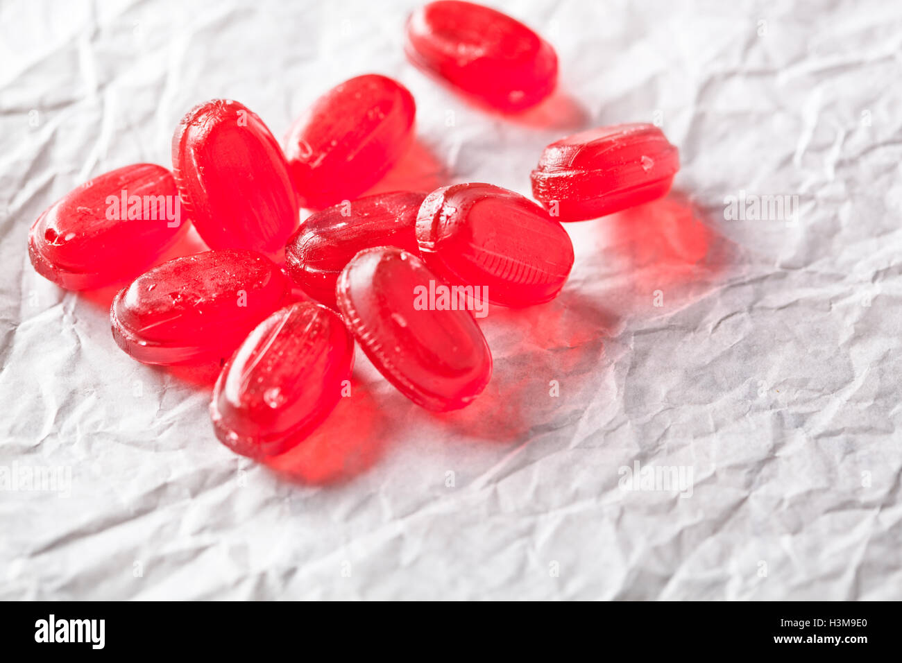 heap of red candies Stock Photo - Alamy