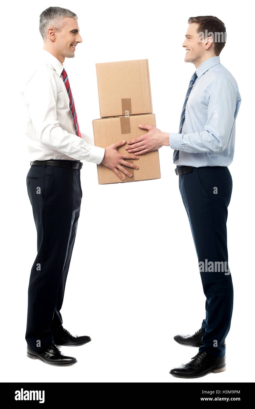 Smiling male courier boxes Cut Out Stock Images & Pictures - Alamy