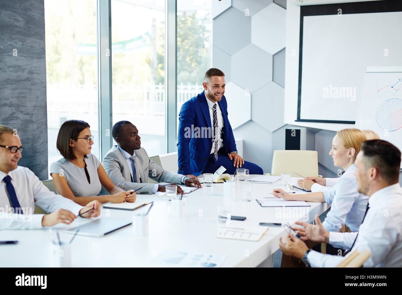 Group of managers having conversation at working seminar Stock Photo ...