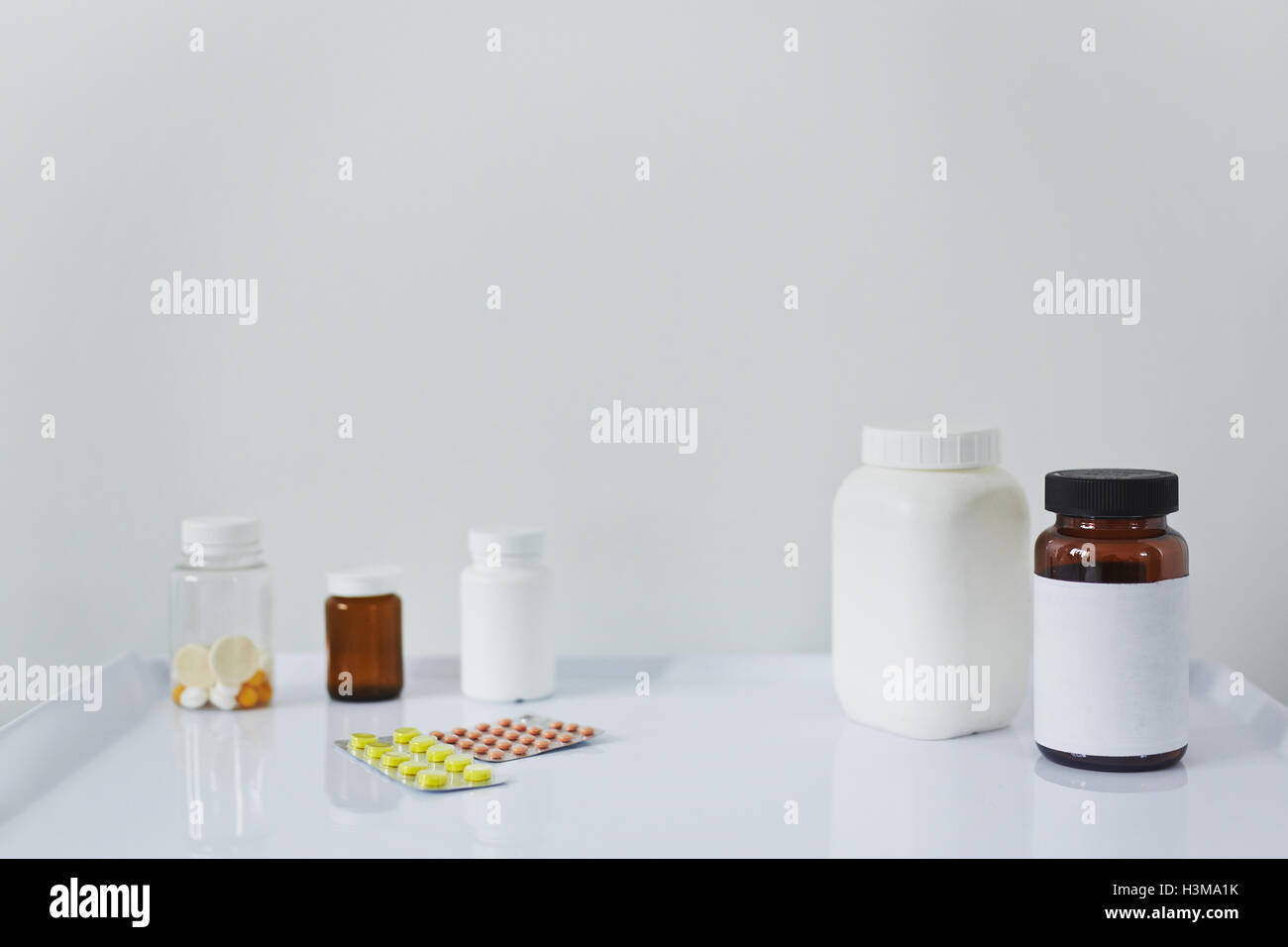 Packed tablets and pills on table Stock Photo - Alamy