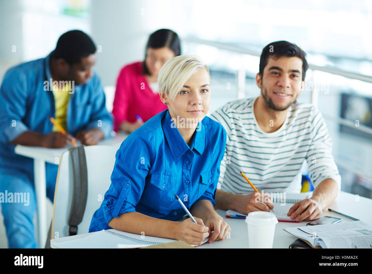Modern students attending lecture in college Stock Photo - Alamy