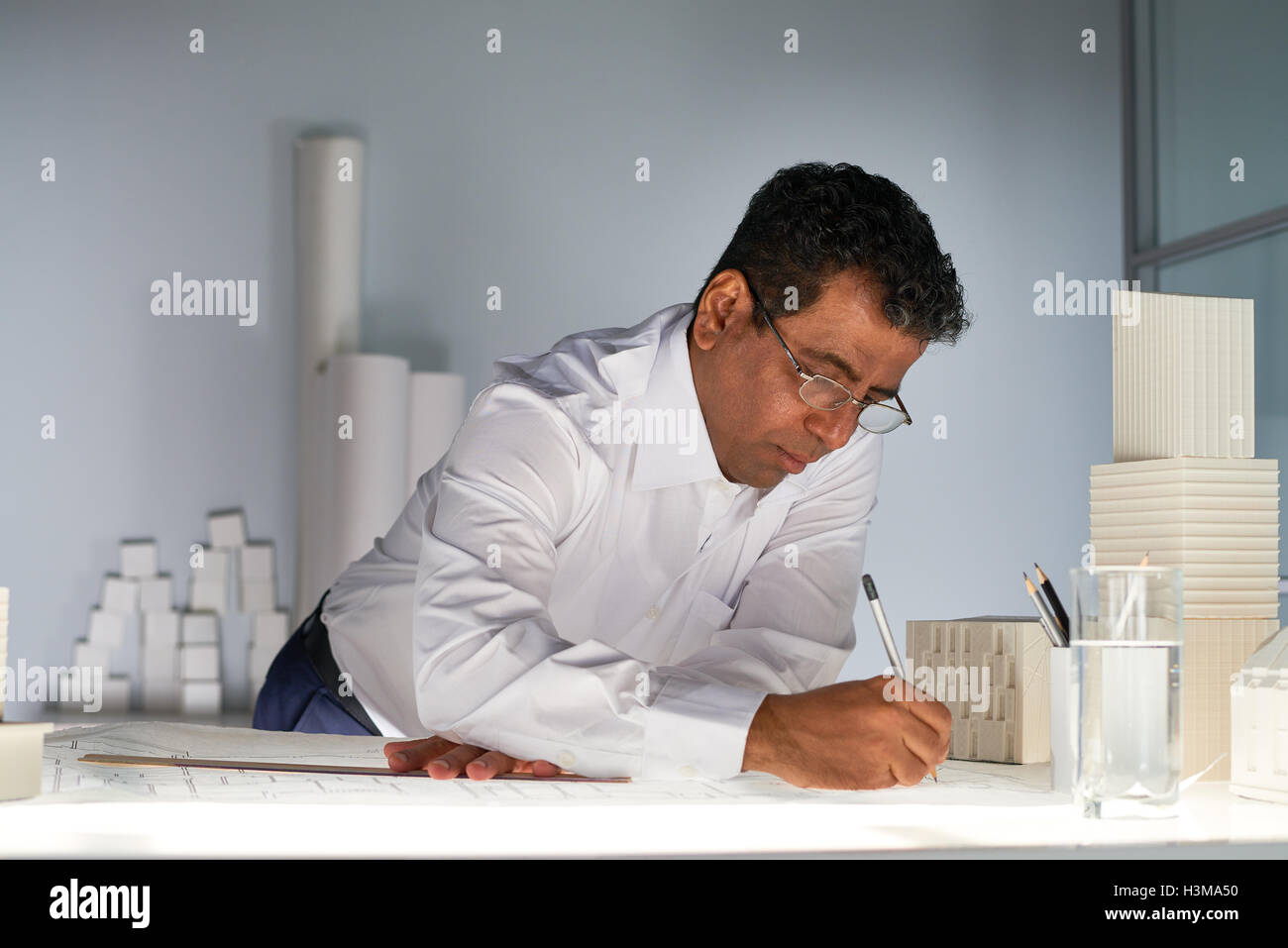 Engineer drawing sketch of architectural construction Stock Photo - Alamy