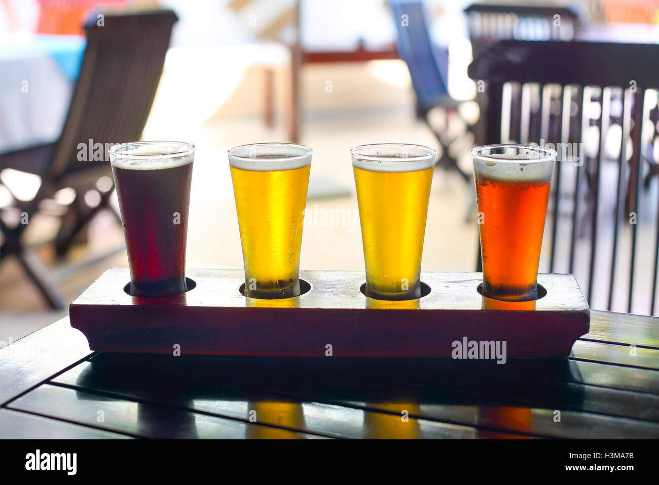 Four sorts of beer. Beer tasting. Ale, porter, lager, pilsner Stock ...