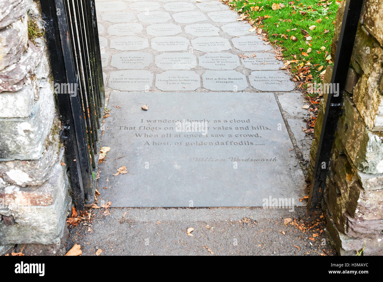 Inscription on paving, entrance to graveyard where poet William ...