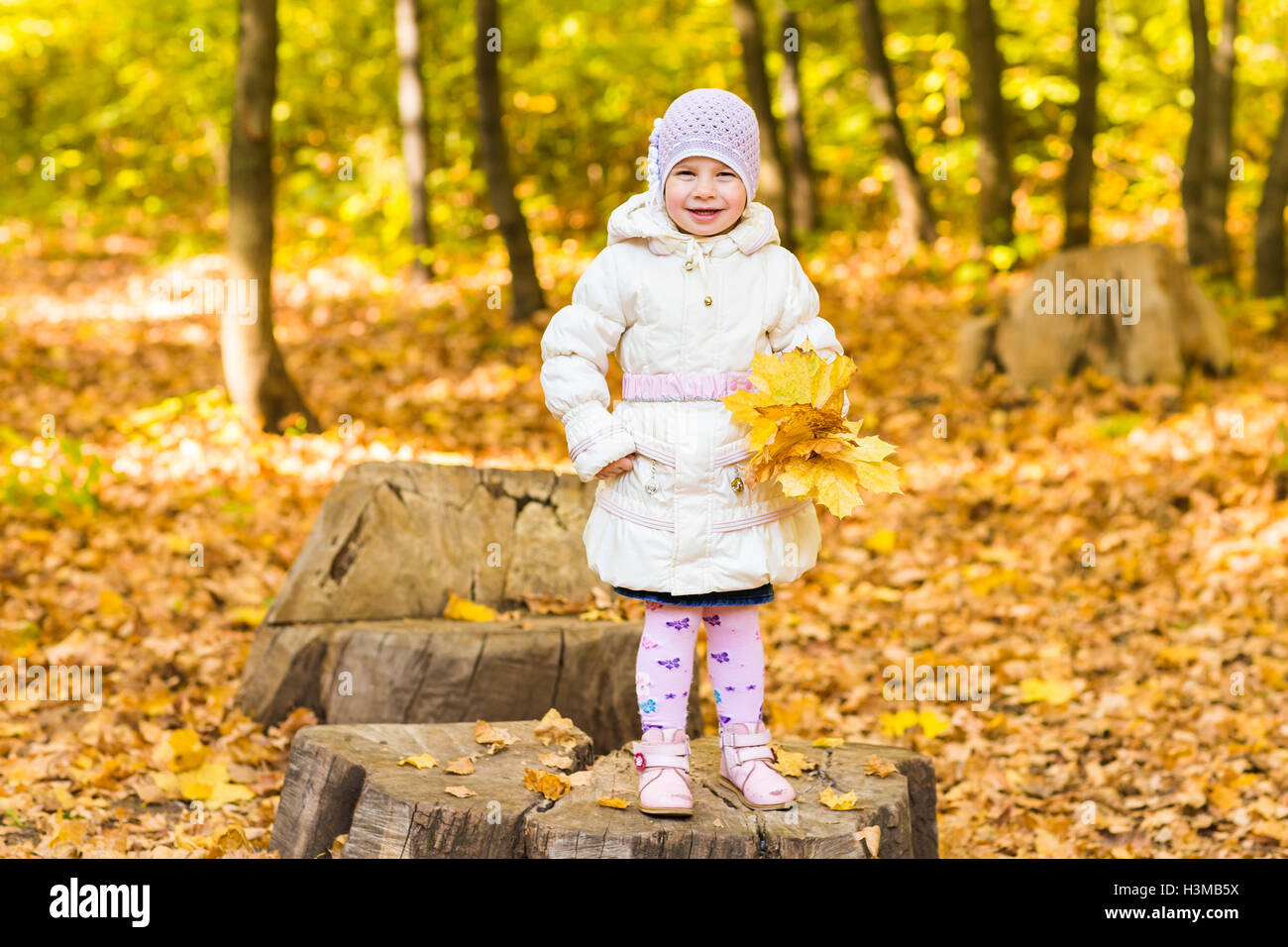 cute baby girl in fall time Stock Photo - Alamy