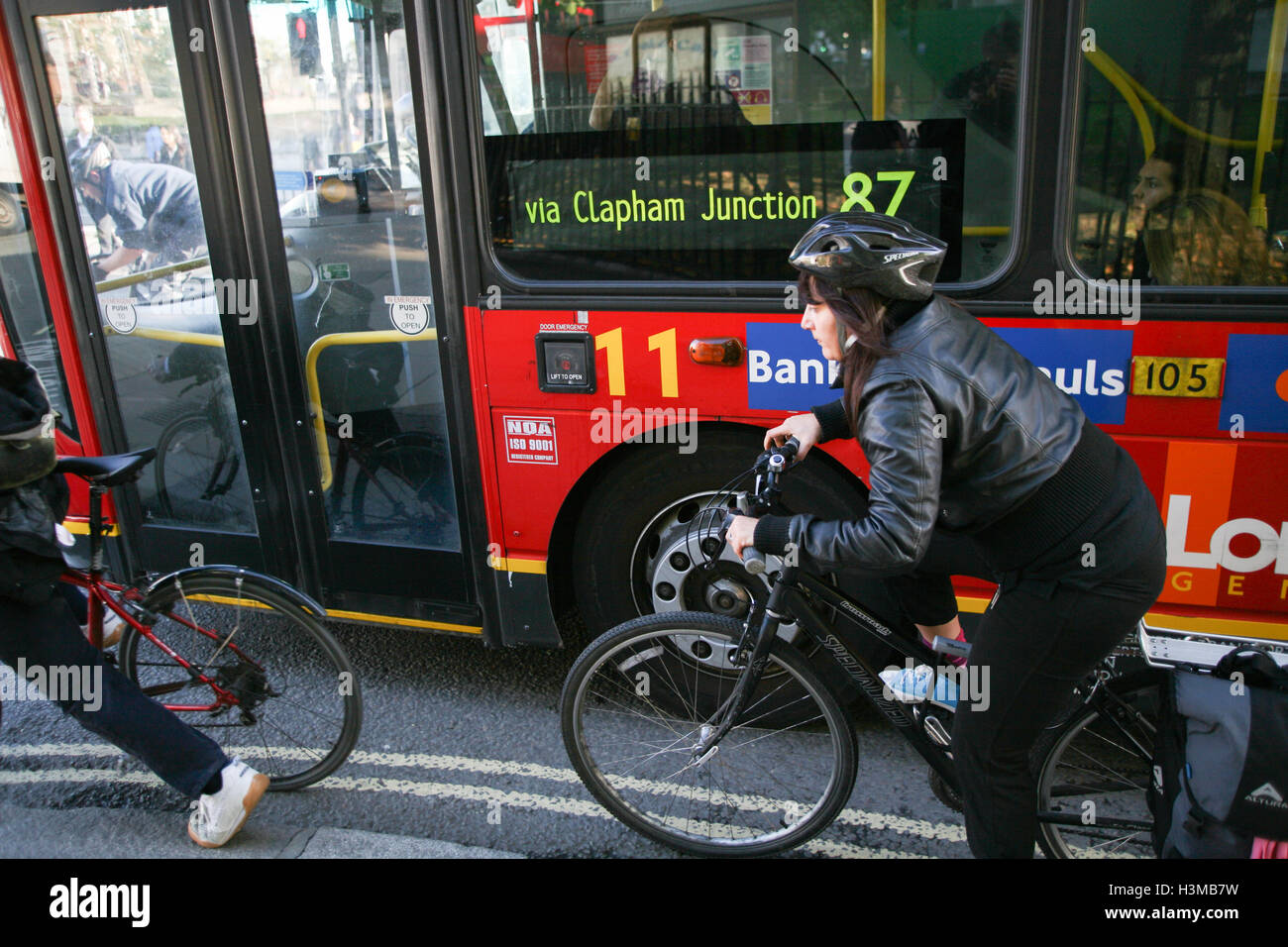 Cyclist waits at traffic lights, no cycle path, at Parliament Square ...