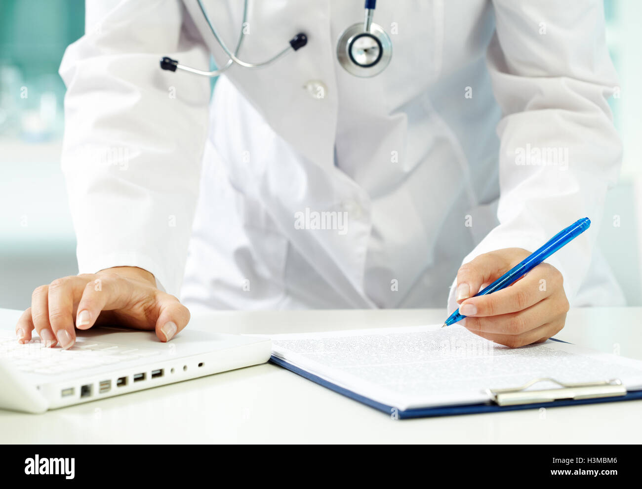 Filling in medical documents Stock Photo - Alamy