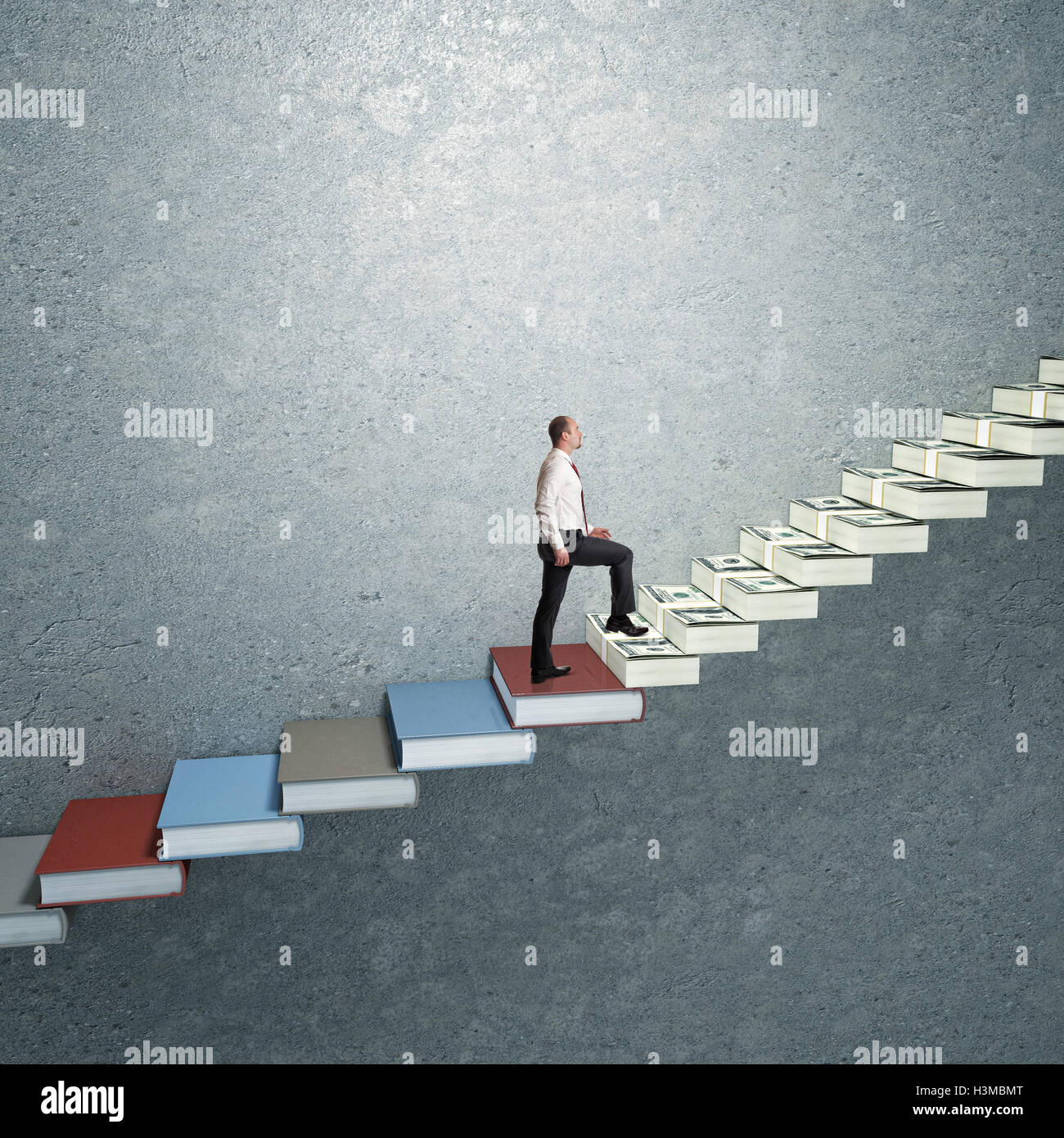 man go up on money and book stair Stock Photo - Alamy