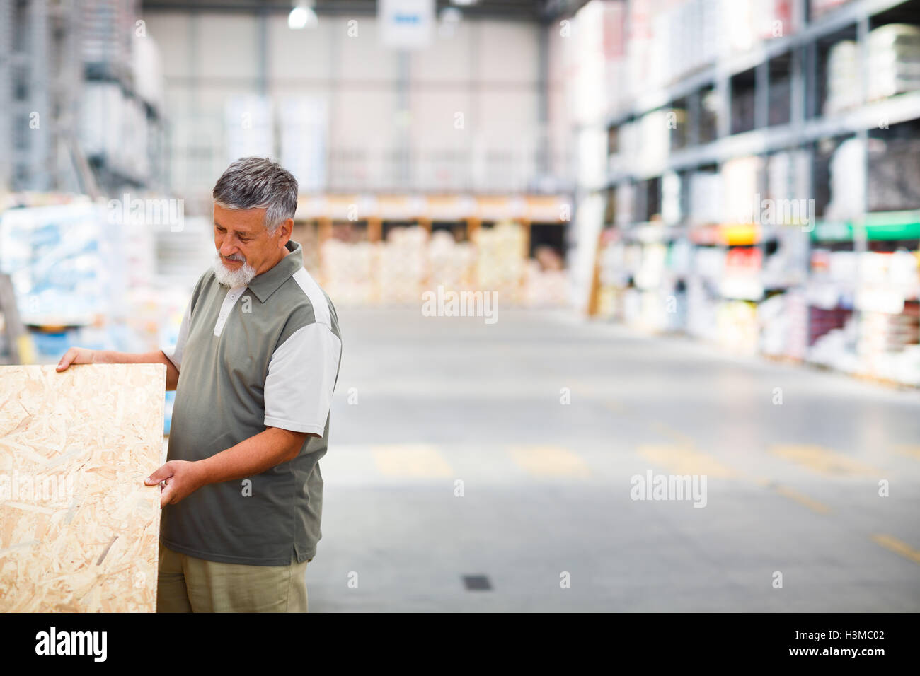 Man buying construction wood in a DIY store Stock Photo - Alamy