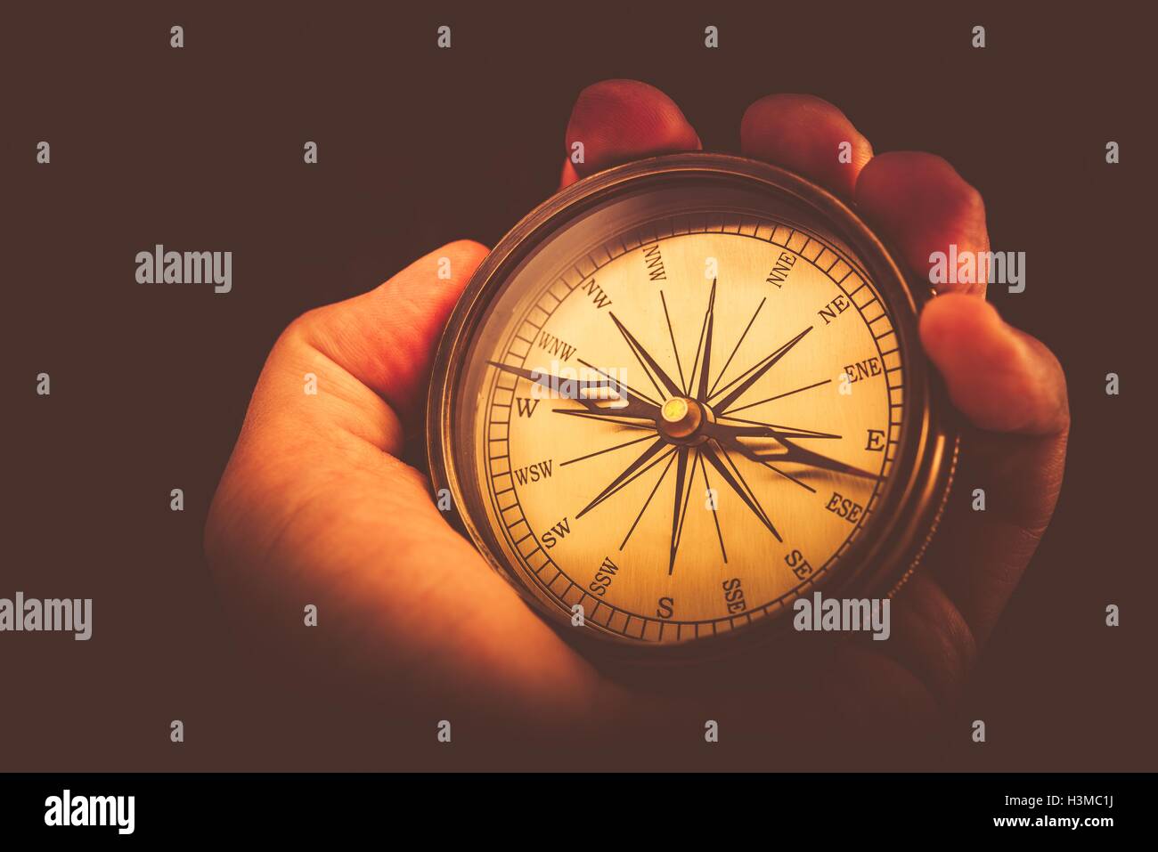 Reading Vintage Compass. Compass Device in Hand Closeup Photo ...