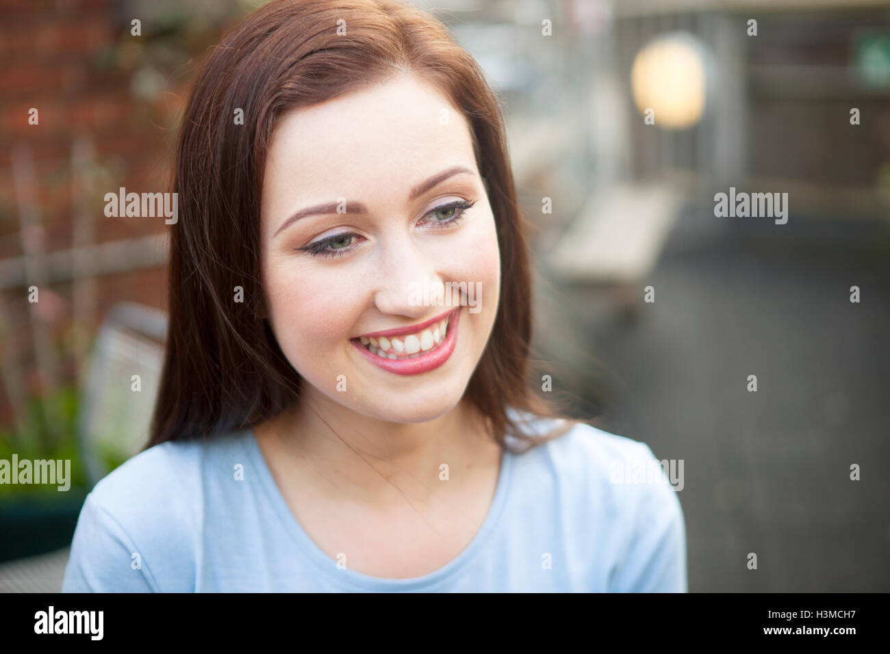 Young woman smiling Stock Photo - Alamy
