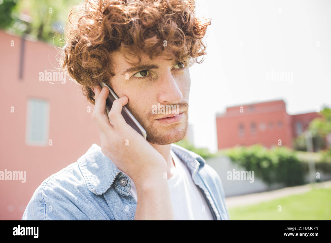 Man using cellular phone outdoors Stock Photo - Alamy