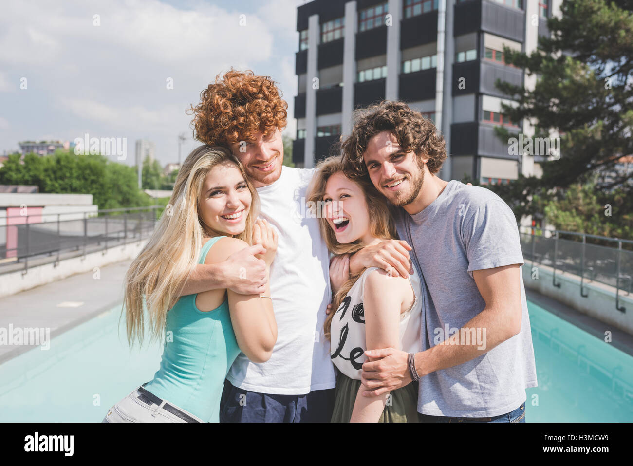 Couple hugging in pool hi-res stock photography and images - Alamy
